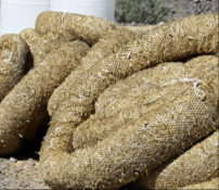 Rolls of straw wattle